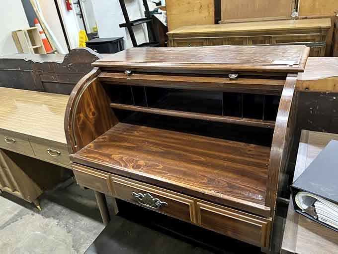 This roll-top desk has more character than most reality TV stars and infinitely better storage solutions.