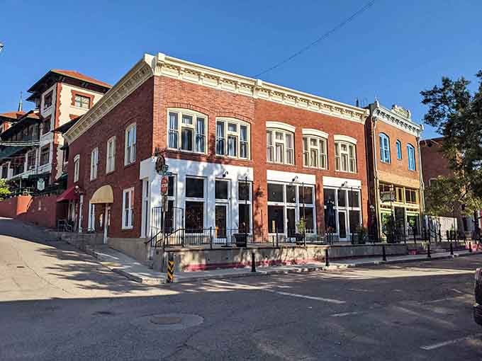 Brick corners and white trim create the kind of architectural harmony that would make any city planner weep with joy.