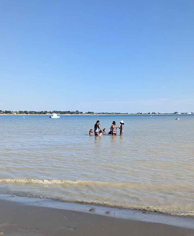 Shallow, warm water where families wade without that alpine lake shock that makes you reconsider everything.