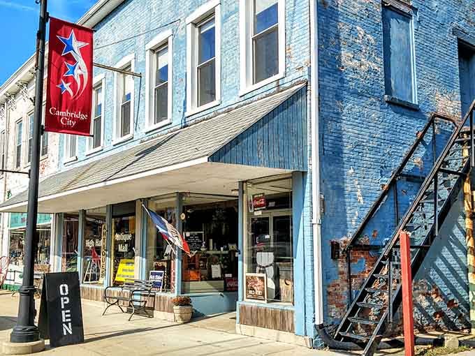 That weathered blue facade holds more treasures than your uncle's garage, but everything's actually worth keeping here.