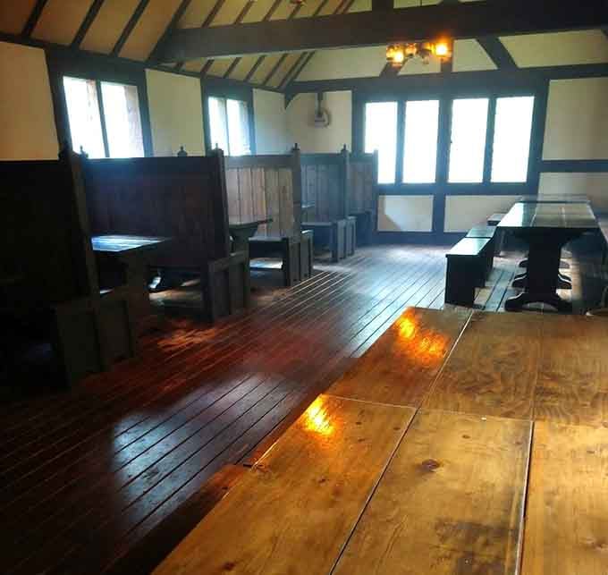Sunlight streams through authentic timber framing onto tables where feasts have been served since, well, the 1300s-ish.