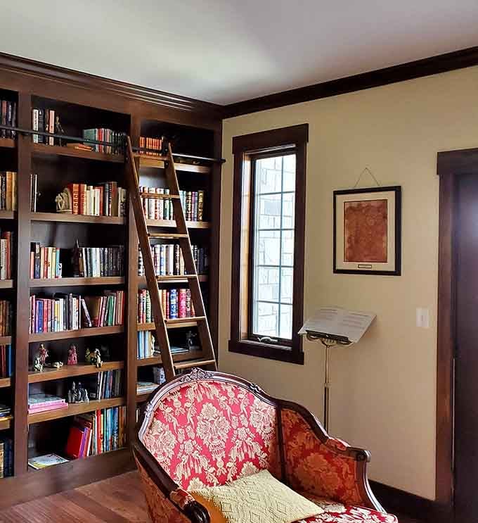 A rolling ladder and floor-to-ceiling books create the library every bookworm has dreamed about since childhood.