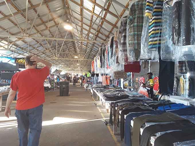 Rows of clothing hang like a rainbow exploded in the best possible way inside this treasure trove.