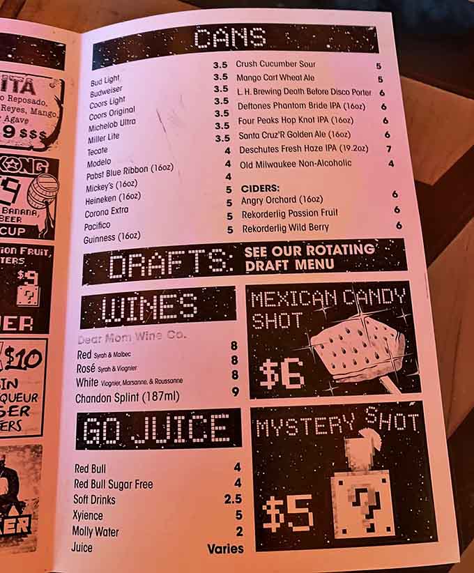 The drink menu speaks fluent arcade, with pixelated graphics that would make your old Nintendo jealous.