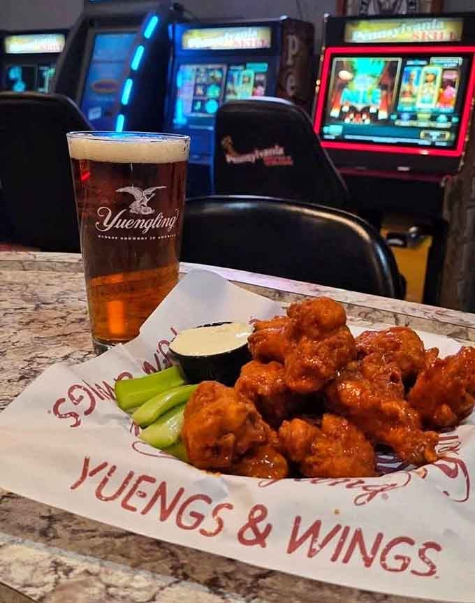 Golden-glazed wings paired with Yuengling, because Pennsylvania knows how to honor its local brewing heritage with style.