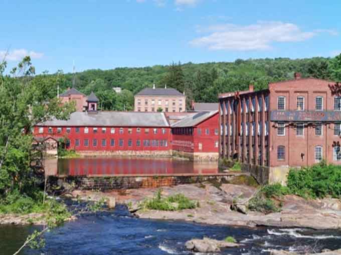 The Collins Company complex stands proud along the water, proof that factories can age more gracefully than most of us.
