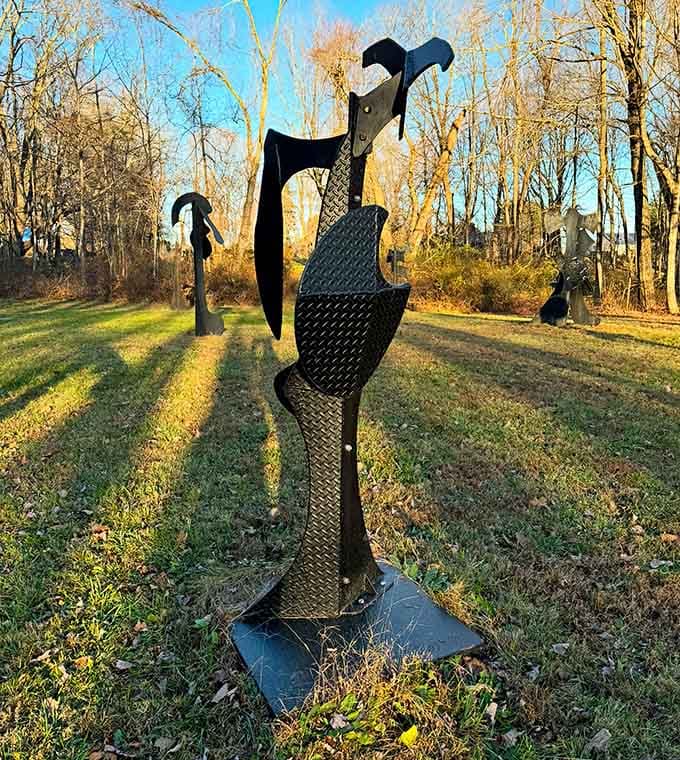 This striking vertical sculpture reaches toward the sky, standing as a beautiful and bold centerpiece within the tranquil natural landscape.