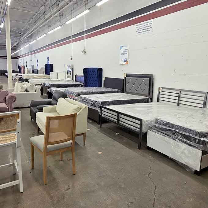 Mattresses and bed frames lined up like they're auditioning for your bedroom, each one hoping to be chosen.