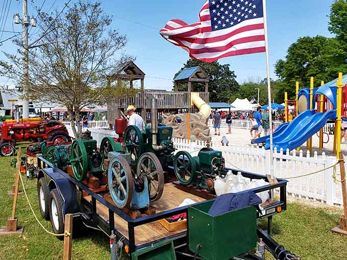 Vintage tractors meet modern playgrounds in a scene that perfectly captures Elberta's delightful mix of old and new.