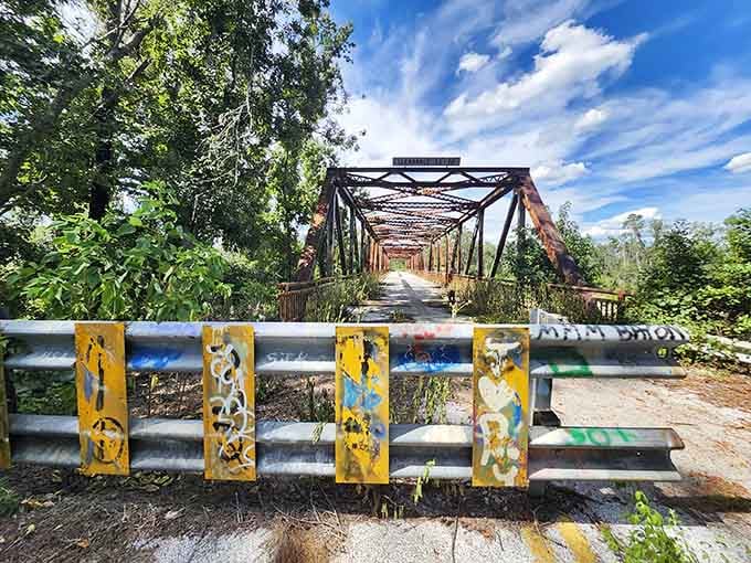 The Bellamy Bridge's weathered yellow railings have seen better days, but they've got stories that new construction could never tell.