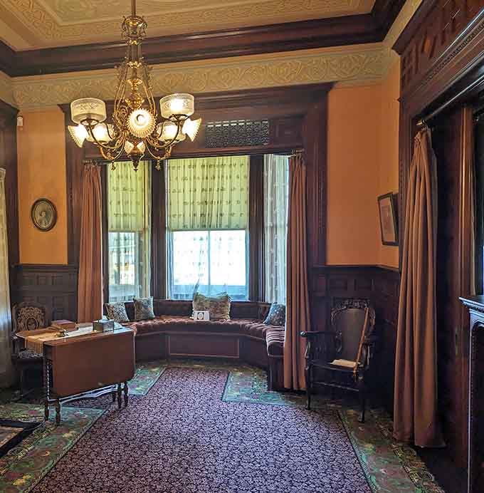 That window seat was made for contemplating life's mysteries while feeling impossibly elegant and slightly overdressed.