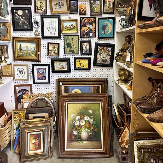 Wall-to-wall art creates an impromptu gallery where every piece tells its own quirky story.