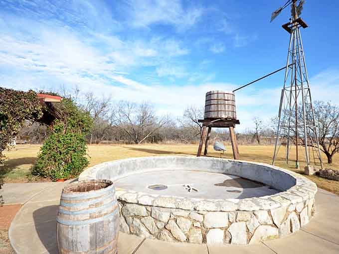 Nothing says Texas quite like a rustic water feature that's seen more sunsets than your retirement calendar.