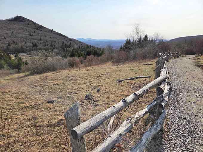 Rustic split-rail fencing frames views that make you understand why people write poetry about mountains and wide-open spaces.