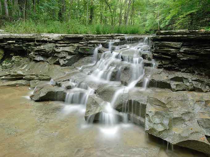 Water cascades over ancient limestone shelves in a display that puts your backyard fountain to shame completely.