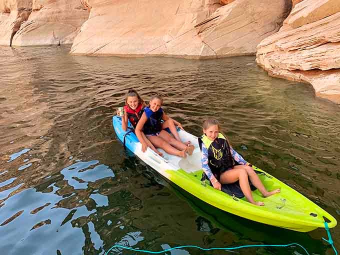 Three generations sharing one kayak, proving adventure has no age limit in these stunning waters.