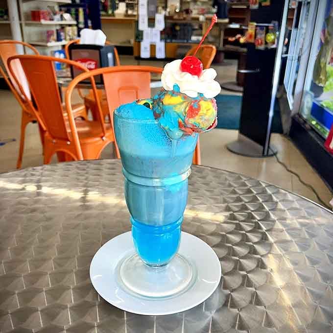 This blue raspberry creation looks like someone bottled pure happiness and topped it with a cherry for good measure.