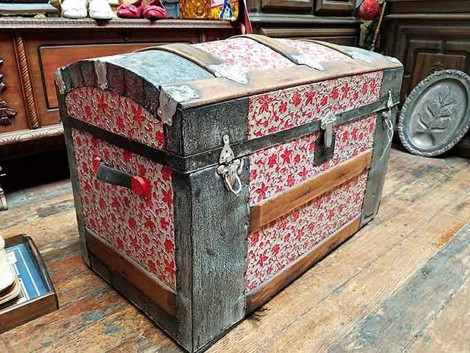 This weathered trunk has probably traveled more miles than your average frequent flyer, stories included free.