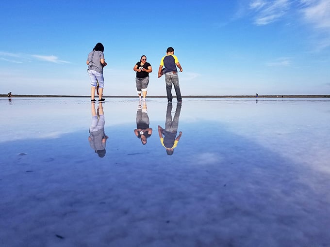 Walking on water becomes reality when the shallow lake creates perfect mirror images of everyone who visits.