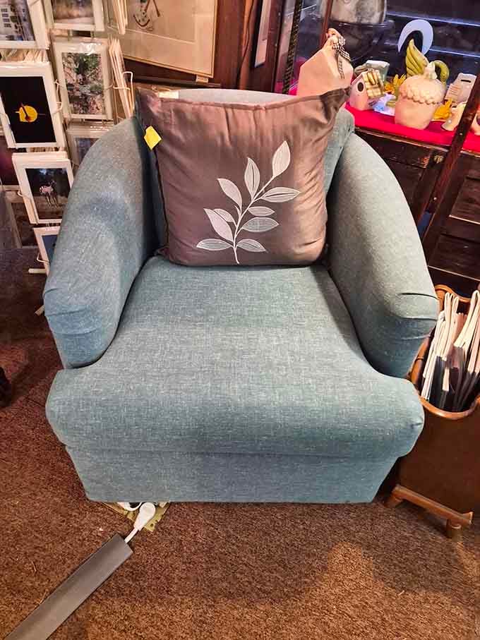 That seafoam armchair is begging for a cozy reading nook, complete with a good book and zero interruptions.