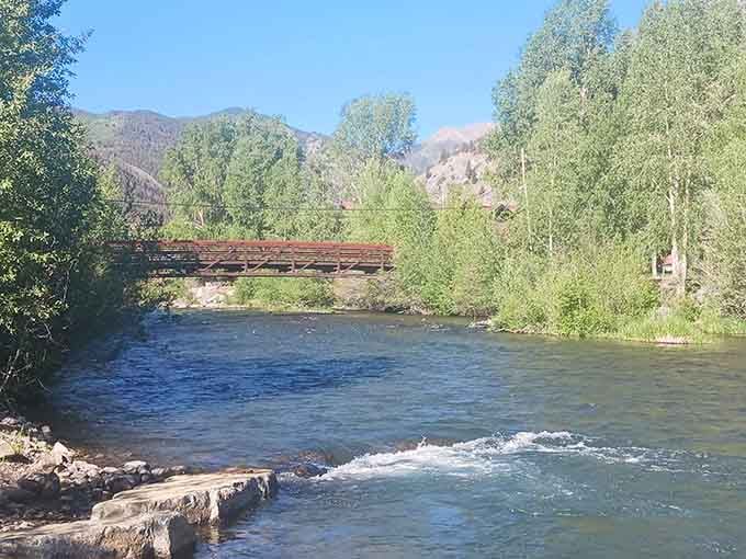 The Lake Fork of the Gunnison River flows through town like nature's own Main Street parade, minus the marching bands.