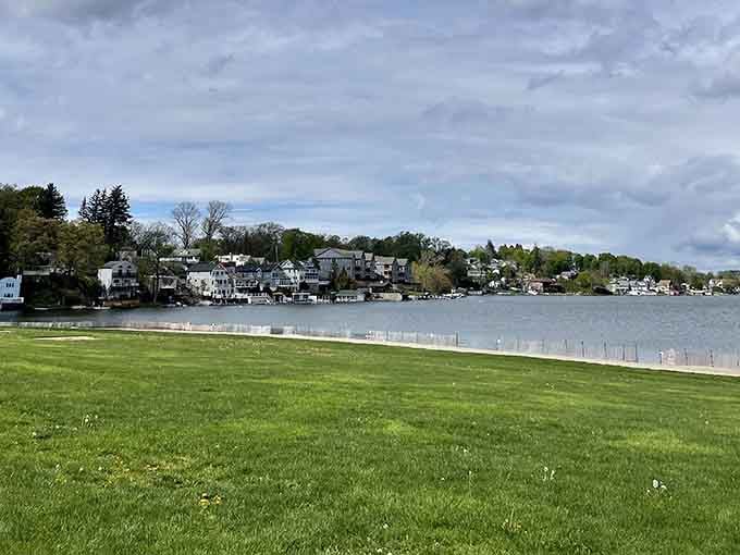 That emerald lawn stretching to the shoreline is basically nature's invitation to pack a picnic and stay awhile.