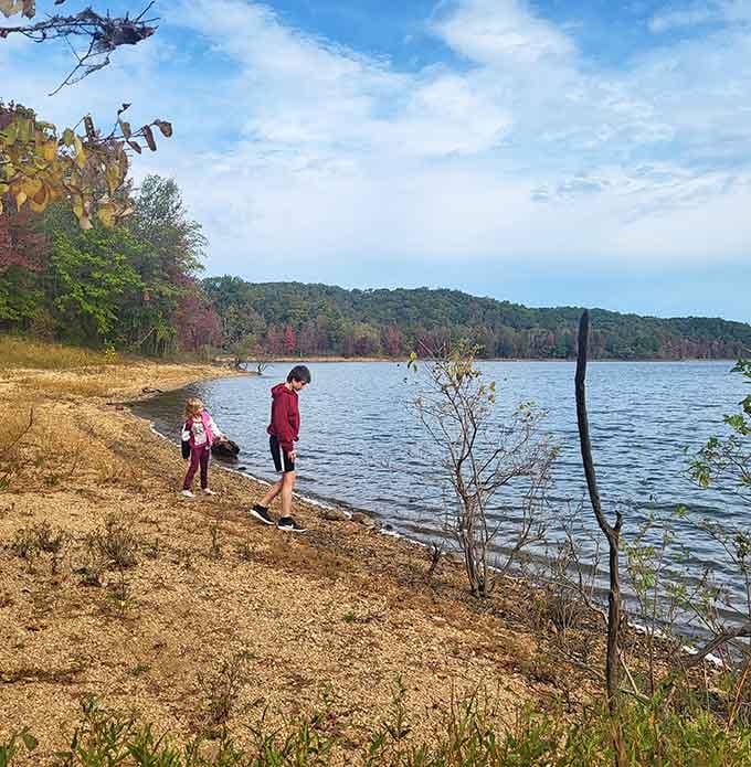 Kids exploring the shoreline like tiny adventurers discovering their own private island paradise in southeastern Missouri.