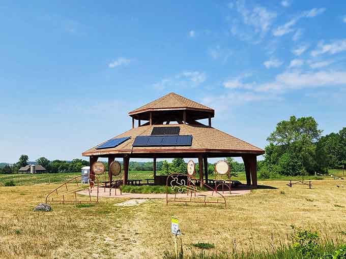 Solar-powered and surrounded by mounds, this pavilion proves modern amenities can respect ancient landscapes beautifully.