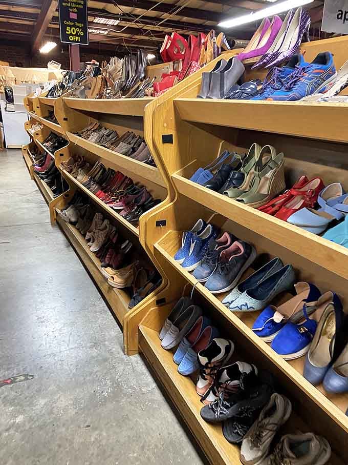 Those wooden display shelves hold everything from running shoes to dress heels, all neatly organized by size.