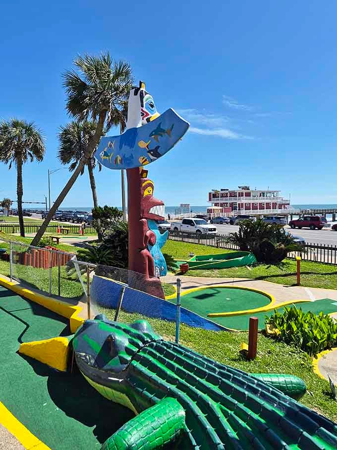 A crocodile and colorful tower standing guard means you're entering a world where imagination runs wild.