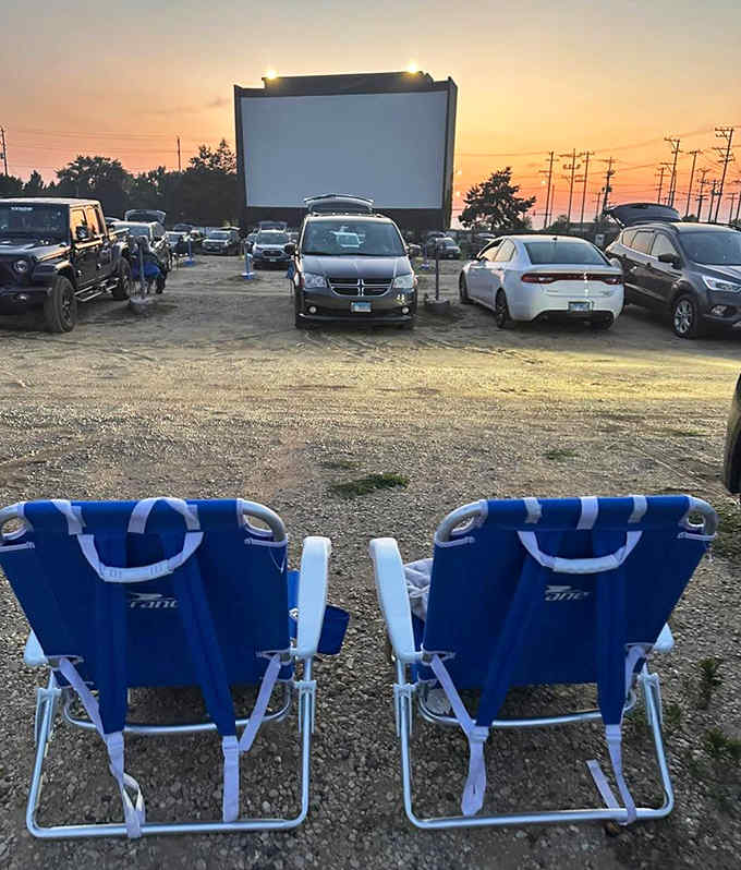 Lawn chairs facing the big screen: proof that sometimes the best seat isn't inside at all.