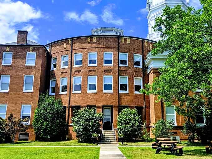 The Old Courthouse stands proud, holding centuries of stories within its brick walls and white columns.