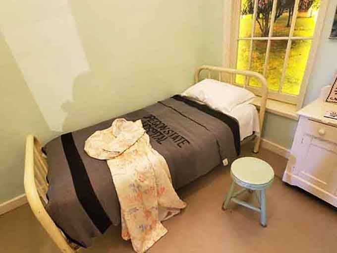 This recreated patient room feels uncomfortably real, complete with restraints that'll haunt your dreams tonight.