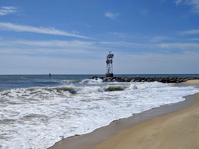 Waves crash against the jetty in nature's most reliable performance, free admission and spectacular every time.