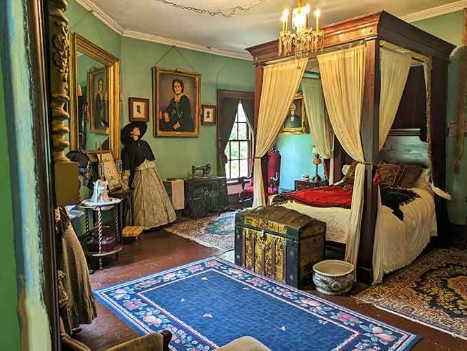 This bedroom's period furnishings transport you straight back to the 1860s, complete with canopy bed drama.