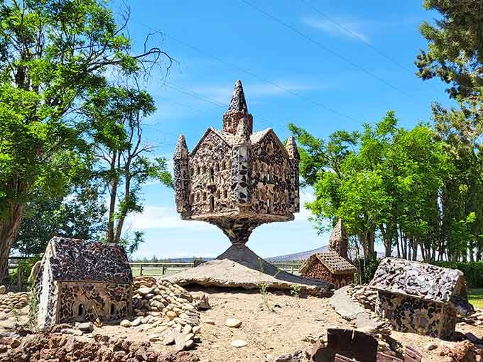 Perched atop its pedestal, this miniature castle defies gravity and common sense in the most delightful way imaginable.