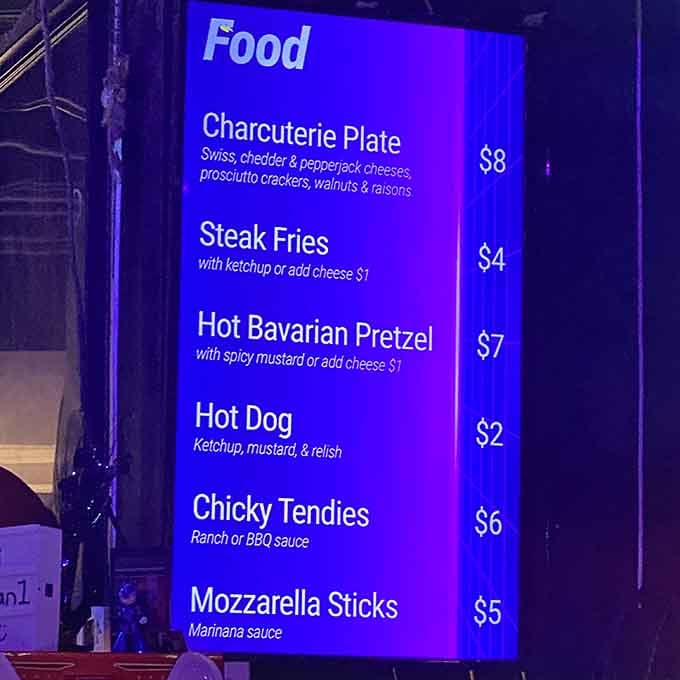 A menu that speaks the universal language of comfort food, perfectly designed for one-handed eating between games.