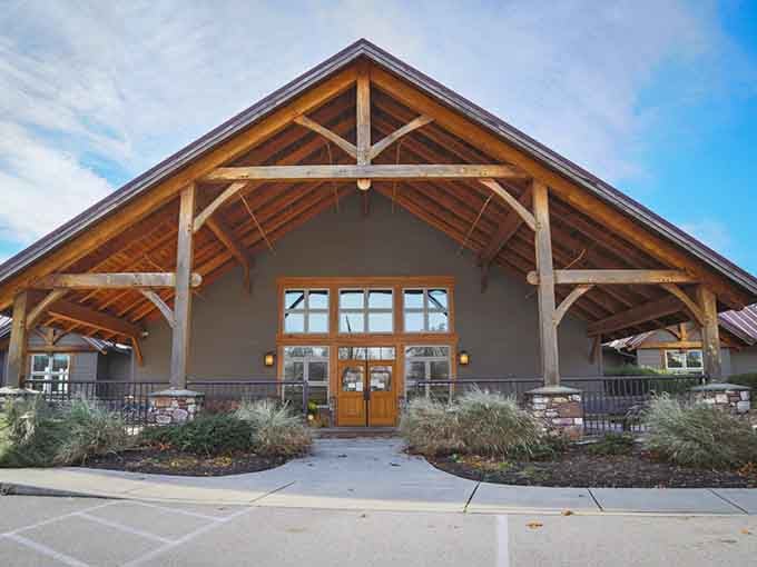Rustic timber beams frame the entrance like a mountain lodge that serves exceptional food instead of trail mix.