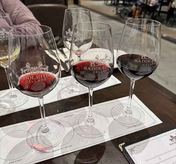 Four glasses of locally-produced wine lined up like soldiers ready to transform your afternoon into something memorable.