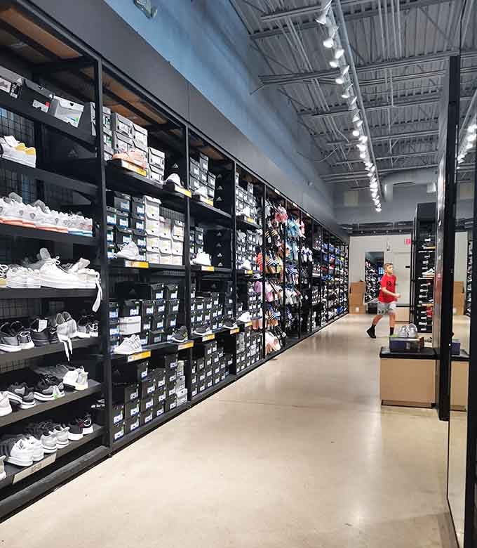 Wall-to-wall sneakers in every color imaginable, because apparently one pair of white shoes is never enough.