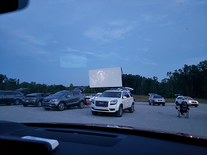 The screen glows with life as dusk settles, proving that some viewing experiences can't be replicated on your couch.