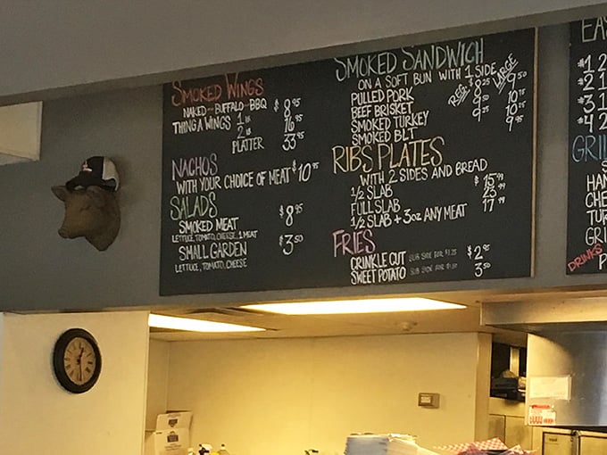 Chalkboard menus listing smoked meats and rib plates make choosing your next meal deliciously difficult here.