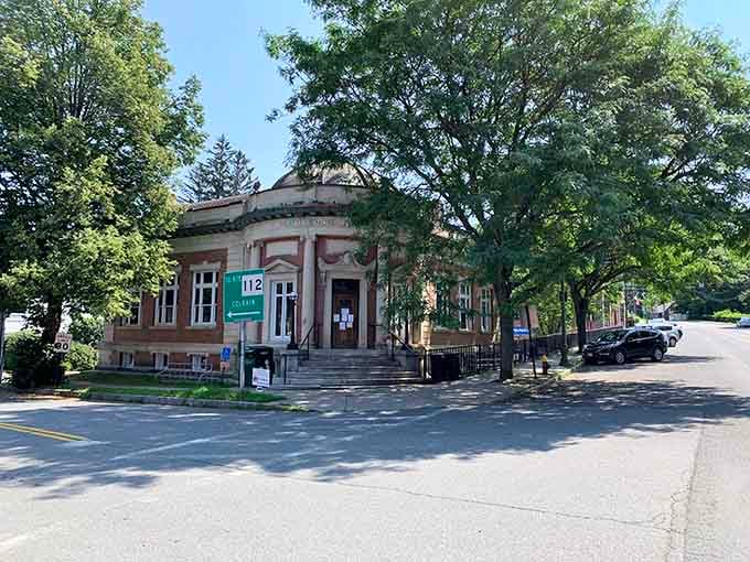 The historic library stands proud, reminding everyone that some buildings have more character than entire suburban developments.