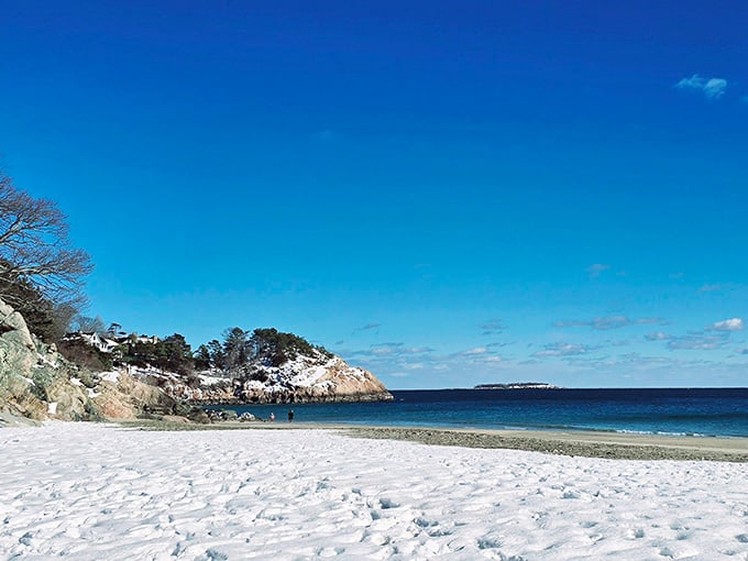 Winter transforms the beach into a pristine wonderland where footprints become temporary art on powdery sand.