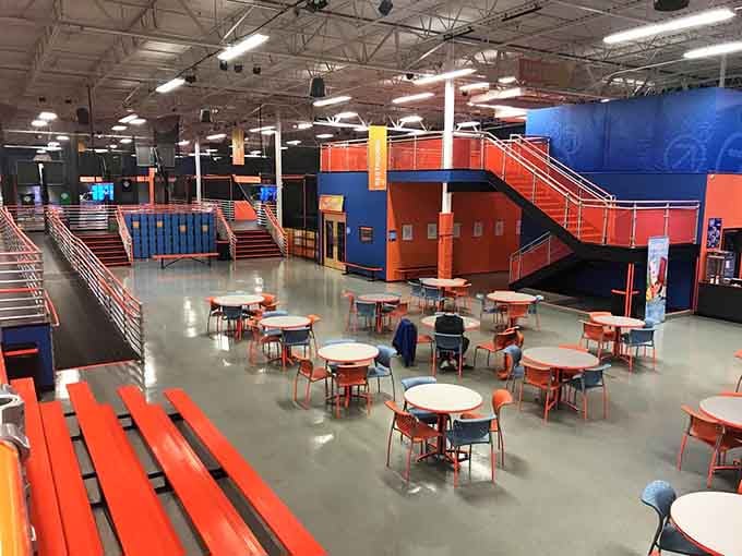 A sprawling arena of organized chaos where adults rediscover muscles they forgot existed since the Reagan administration.