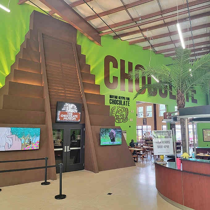 Inside, vibrant green walls meet chocolate-brown architecture in a color scheme that somehow just works perfectly.