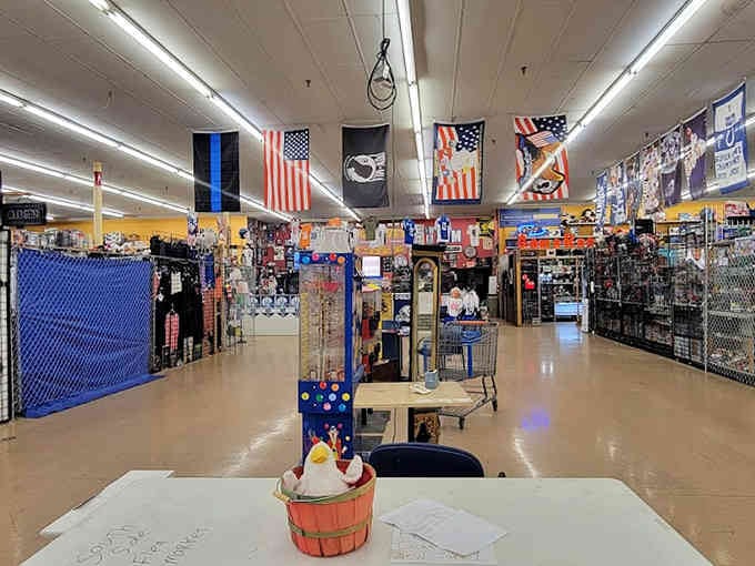 American flags wave overhead while endless booths stretch before you, each one a potential jackpot waiting to happen.