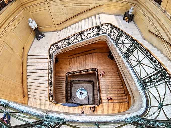 This staircase spirals down like something from an Escher painting, minus the headache and existential confusion.