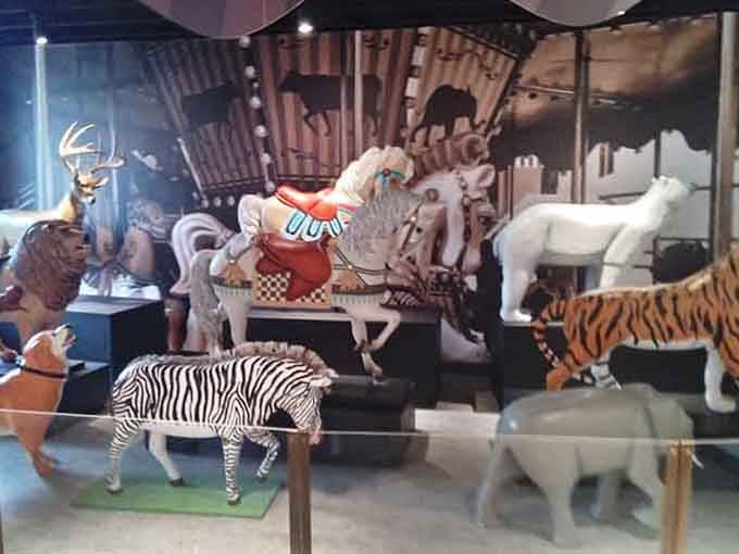 Carousel animals share space with barbering exhibits because apparently this museum believes in giving you delightful surprises around every corner.