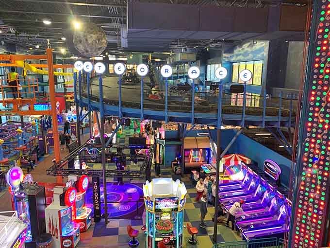 Looking down from above reveals the beautiful chaos of an indoor amusement park firing on all cylinders at once.